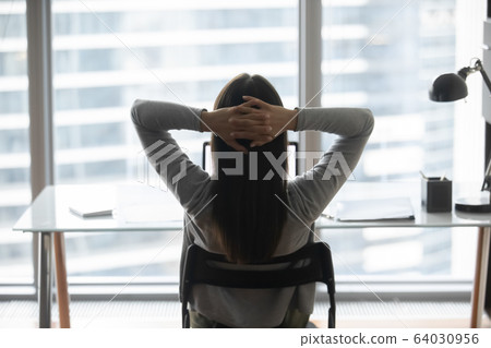 Back view of young woman employee relax at... - Stock Photo [64030956 ...