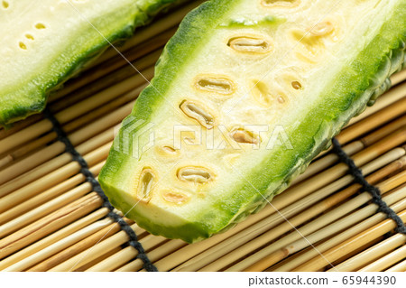 Cross section of bitter gourd cut in half... - Stock Photo [65944390 ...