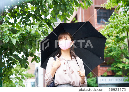 Time lag work A business woman wearing a rain... - Stock Photo ...