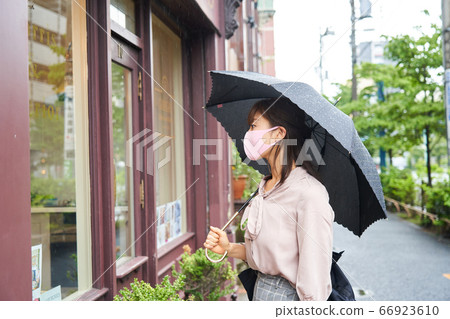 Time lag work A business woman wearing a rain... - Stock Photo ...