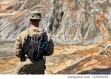 male geologist on an expedition among a desert - Stock Photo [67649293 ...
