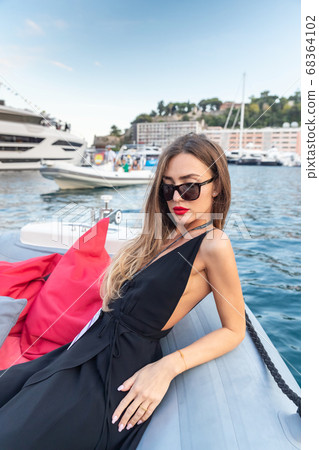 The elegant girl dressed in an evening dress of... - Stock Photo ...