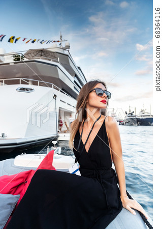 The elegant girl dressed in an evening dress of... - Stock Photo ...