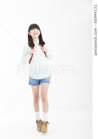 Smiley female elementary school student - Stock Photo [68944131] - PIXTA