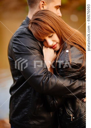 close up. couple hug in autumn park near river. - Stock Photo [69876093 ...