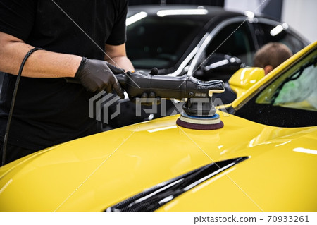 Man car detailing studio worker polishing... - Stock Photo [70933261 ...