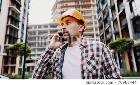 Engineer talking on phone. Architect using... - Stock Photo [70965444 ...