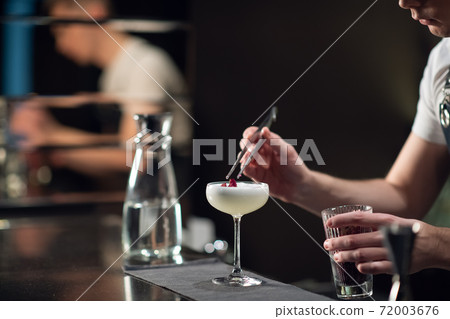 Close-up of the process of preparing a cocktail... - Stock Photo ...