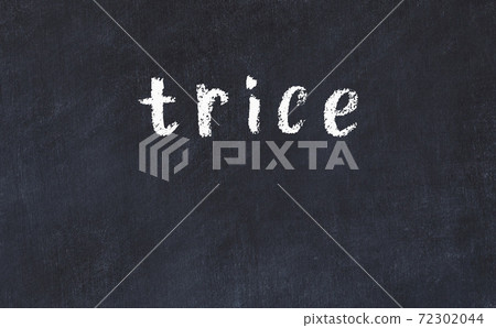 Black chalkboard with inscription trice on in - Stock Illustration ...