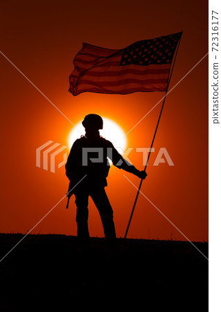 USA army soldier with flag on sunset background - Stock Photo [72316177 ...