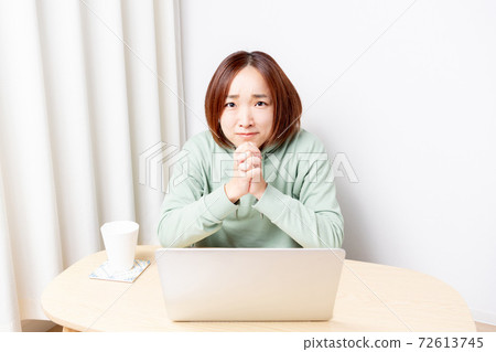 A woman making a request gesture while using a... - Stock Photo ...