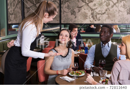 Waitress talking with satisfied guests - Stock Photo [72811640] - PIXTA