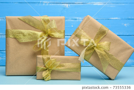 stack of gifts wrapped in brown kraft paper and... - Stock Photo ...