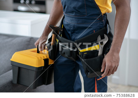 Dark-skinned service man standing in the... - Stock Photo [75388628 ...