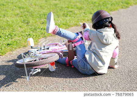 Little Girl Falling Off Bike