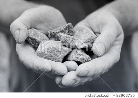 The man holds the rubble in his palms. A... - Stock Photo [82908756 ...