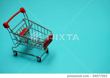 Mini trolley cart on blue background - Stock Photo [84077983] - PIXTA