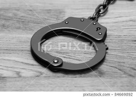 Grayscale 3D render: black locked police handcuffs - Stock Illustration ...