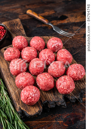 Uncooked Raw meatballs from ground beef and... - Stock Photo [84764748 ...