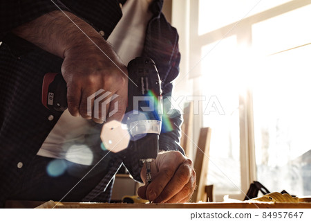 Close up of a carpenter drilling a hole in timber - Stock Photo ...