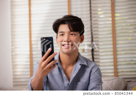 Asian man making facetime video calling with... - Stock Photo [85041344 ...