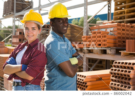 Portrait of two confident managers standing in... - Stock Photo ...