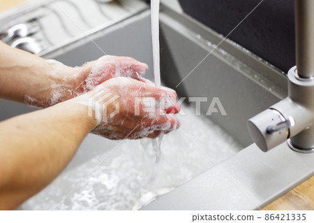 Hand Under Running Water Tap
