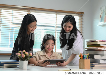 Group of students doing homework together and... - Stock Photo ...