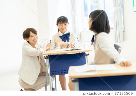 Teacher and female junior high school student... - Stock Photo ...