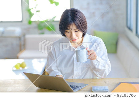 A young business woman who is teleworking to... - Stock Photo [88193700 ...