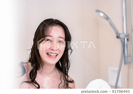 Young woman taking a shower - Stock Photo [91706493] - PIXTA