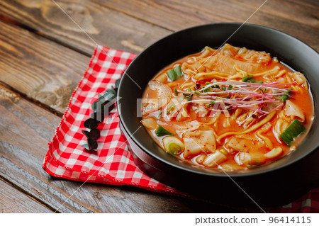 Korean food kimchi spicy kalguksu dish in black... - Stock Photo ...