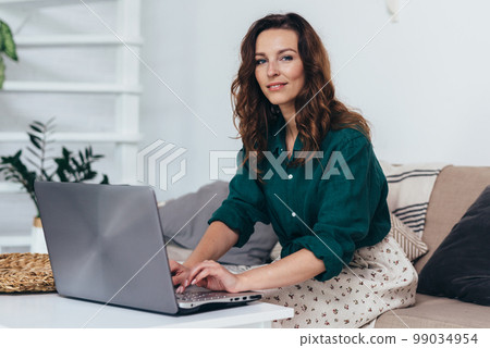 Young woman using laptop and working at home - Stock Photo [99034954 ...