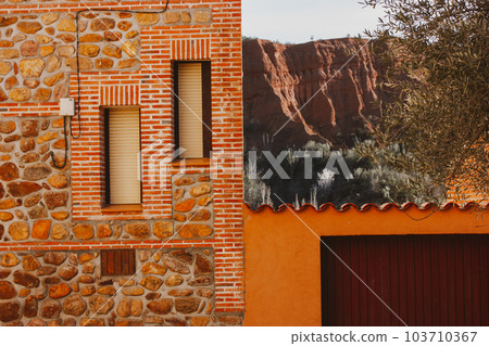 Bright orange brick house with small windows... - Stock Photo ...