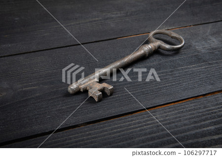 Old rusty key on dark wood texture background - Stock Photo [106297717 ...