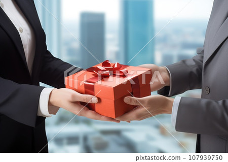 Focus on a woman's hand offering a gift with a... - Stock Illustration ...