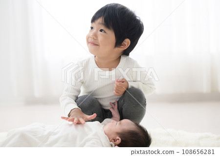 A wonderful older brother who cares for his... - Stock Photo [108656281 ...