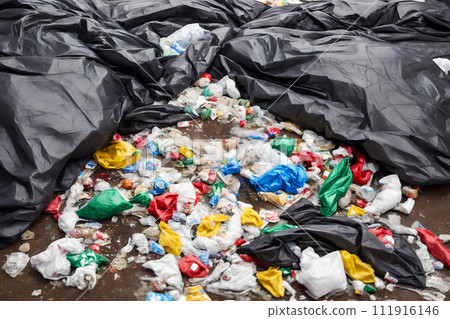 Black trash bag with garbage spilling out on... - Stock Illustration ...