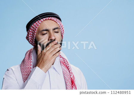 Exhausted muslim man wearing traditional... - Stock Photo [112480951 ...