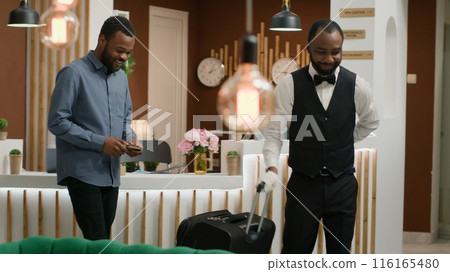 Guest receiving room access card at reception... - Stock Photo ...
