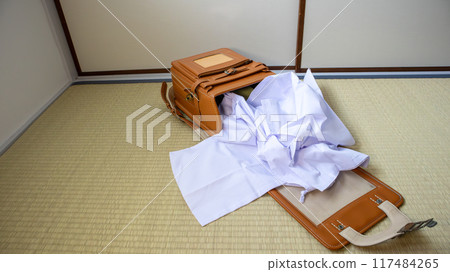 School bag and messy school uniform - Stock Photo [117484265] - PIXTA