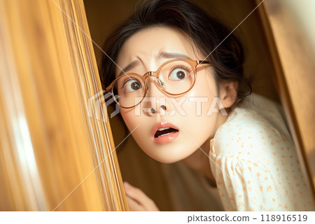 Young woman looking startled while peeking from... - Stock Illustration ...
