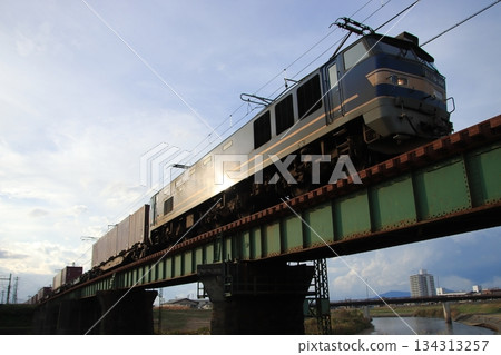 A freight train towed by EF5110-501 runs at... - Stock Photo [134313257 ...